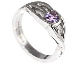 A bespoke platinum and lilac sapphire engagement ring